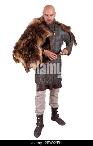 Medieval viking in chain mail and a bearskin rug. Isolated on white ...