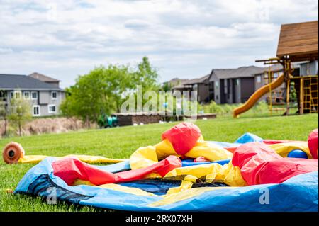 Deflated bouncy house in backyard Stock Photo - Alamy