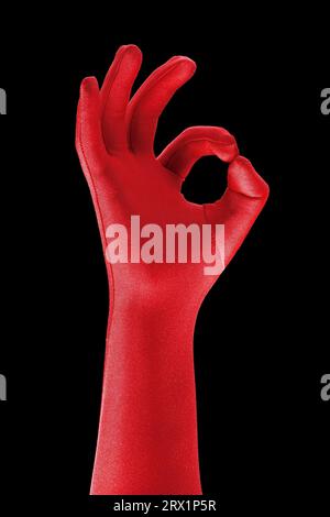 Strange gloved hand doing a OK sign Stock Photo - Alamy