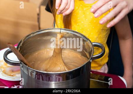 process of preparing of the traditional Armenian sweet Sujuk ...