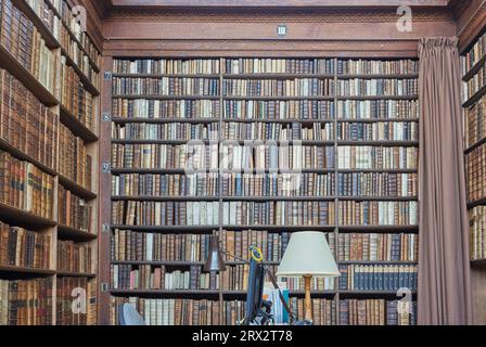 Books in the Wren library at the prestigious college of Trinity at the ...
