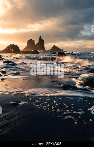 Beautiful golden sunset, north Tenerife, Atlantic Ocean, Almaciga black ...