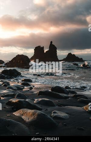 Beautiful golden sunset, north Tenerife, Atlantic Ocean, Almaciga black ...