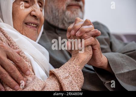 Arabic old couples love each other while holding their hands Stock ...