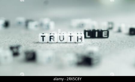 Lie vs. truth in white and black letter bead blocks Stock Photo - Alamy