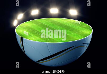 A soccer ball split in half revealing a marked green grass football ...