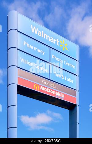 Sign roadside at a Walmart Supercentre listing services available Stock ...