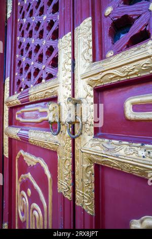 Gilded decoration on wooden windows of Tibetan ancient buildings in ...
