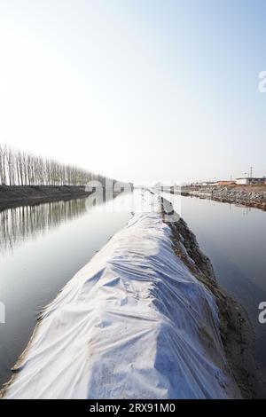 Water conservancy project construction site on the bank of the canal ...