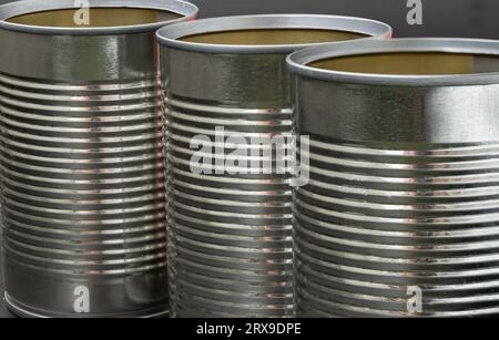Three open empty opened Steel and tin cans arrange. Metal tin cans on ...