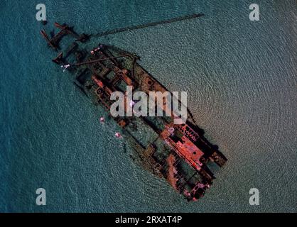 Greece, People dive into the crystal clear waters of the Mediterranean ...