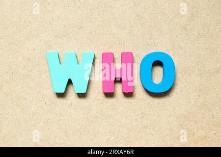 Alphabet letter in word whom on old red color wood plate background ...