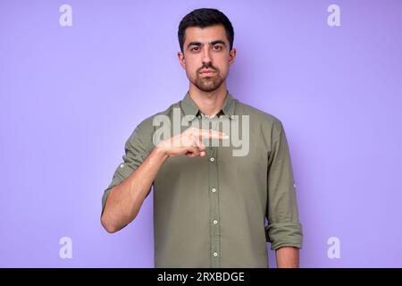 serious handsome man showing letter Z z with fingers .the Alphabet in ...