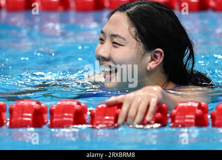 China's Qianting Tang reacts after winning the 100 meters breaststroke ...