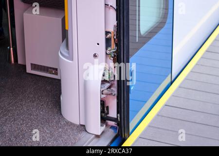 The mechanism of closing and opening doors in a subway train car/ Close ...