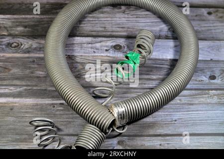 A broken flexible hose from a vacuum cleaner, substandard materials and ...