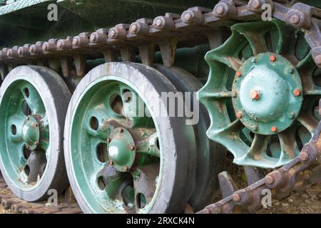 Old tank with green painted tracks Stock Photo - Alamy