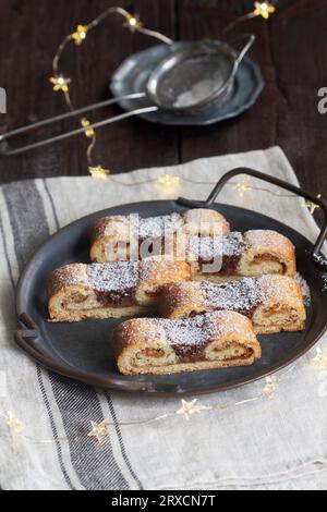 Sweet dessert - pinwheel cake with vanilla pudding on white plate Stock ...