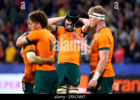 Australia's Nick Frost (centre) looks dejected following defeat in the ...