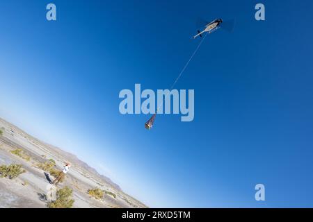 OSIRIS-REx Sample Return. Recovery and curation teams join a container ...
