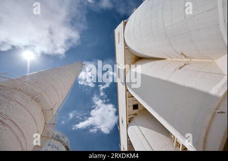 Brick chimney and concrete silos for limestone storage Stock Photo - Alamy