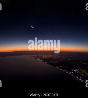 View of Antalya city and city lights from the plane at sunset Stock ...