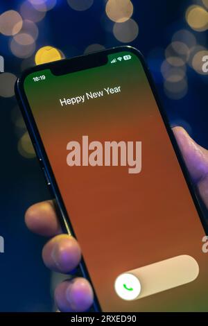 Incoming call screen from Happy New Year, close up Stock Photo - Alamy