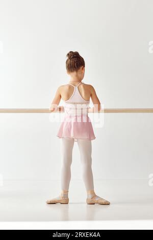 Art class. Rear view of adorable European children painting on canvas ...