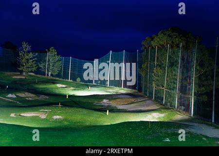 Golf driving range floodlight at night Stock Photo - Alamy