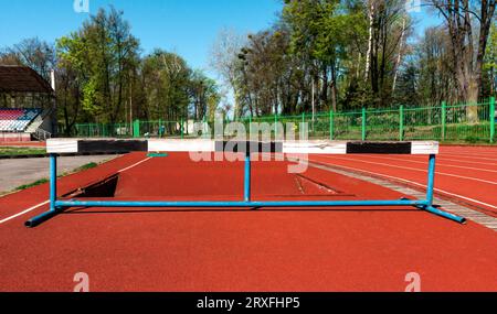 sports barrier. Red treadmills at the stadium. Red racetracks on the ...