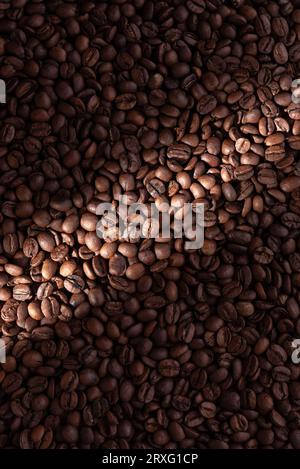 Texture of roasted coffee beans with contrasting dramatic light effect ...