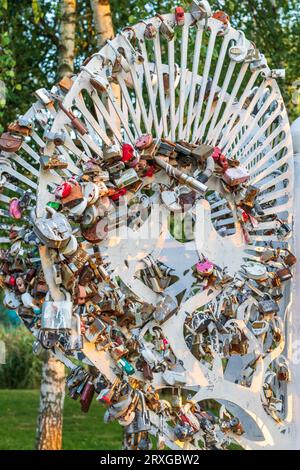 Metal structure where couples locking the locks as a sign of true love ...