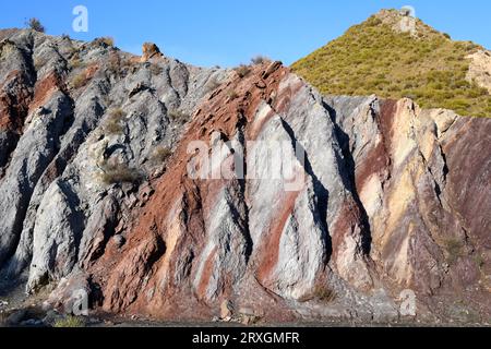 Colorful strata of alterated volcanic rocks. Sopalmo rambla, Cabo de ...