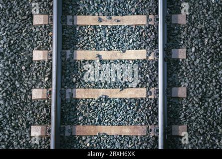 Railway background texture. Steel rails mounted on gray concrete ...