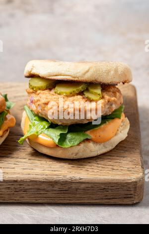 Salmon fishburger english muffin sandwich Stock Photo - Alamy