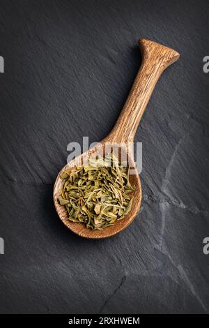 Ruta graveolens - Dried rue leaves in the spoon Stock Photo - Alamy