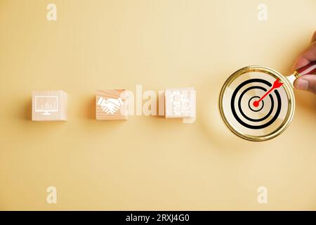 Target icon under magnifying glass Stock Photo - Alamy