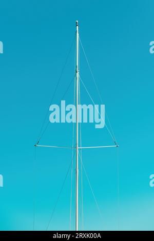 Standing rigging of a boat mast against blue sky Stock Photo - Alamy