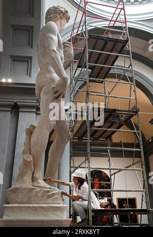 Italian Restorer Eleonora Pucci cleans dust and debris off Michelangelo ...