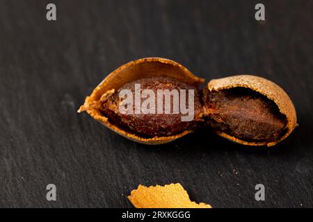 open ripe tamarind pods with edible pulp, ready-to-eat whole tamarind ...