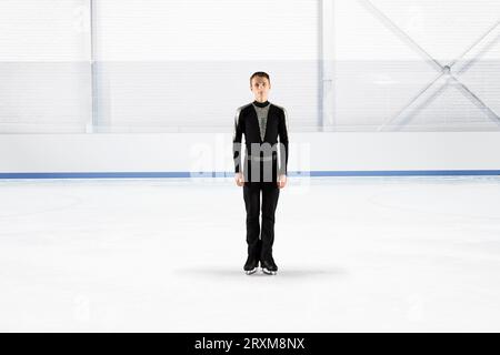 Male figure skater in uniform at ice rink Stock Photo - Alamy