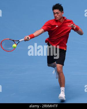 Coleman Wong Chak-lam of Hong Kong returns a shot to Karen Khachanov ...