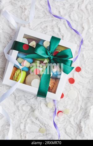 Festive box of colorful macarons, present for Christmas. New Year ...