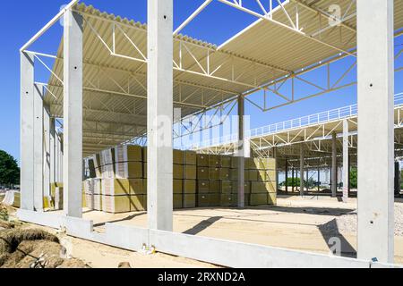 Prefabricated concrete skeleton frame building being constructed, building site. Shot with a ...