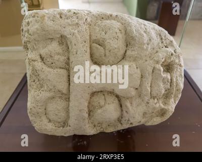 A carved limestone sculpture of Kinich Ahau, the Mayan sun god, in the ...