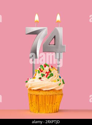 Birthday Cupcake With Candle Number 74 - On Hot Pink Background Stock ...
