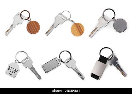Set with keys and key chains isolated on white Stock Photo - Alamy