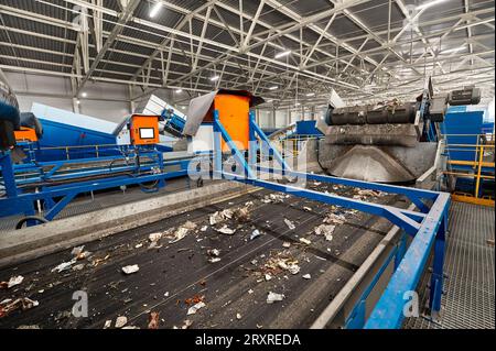 Wide belt conveyor with moving debris. Waste sorting plant Stock Photo ...