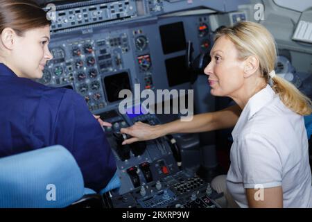 Female pilot in flight simulator during training Stock Photo - Alamy