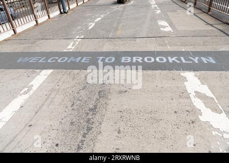 welcome brooklyn sign of brooklyn bridgeroad way to manhattan, new york ...